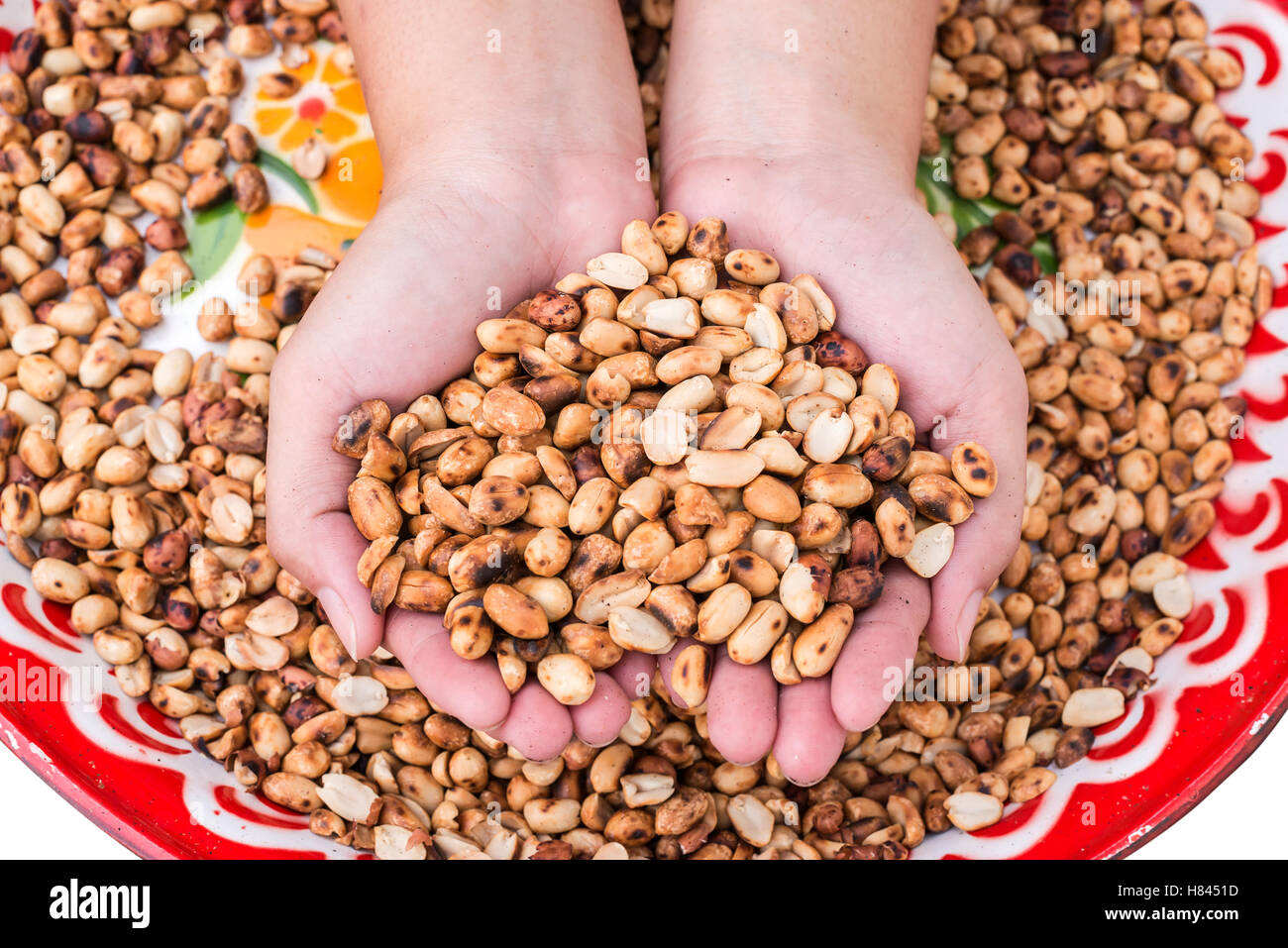 Roasted peanuts in woman hand Stock Photo - Alamy