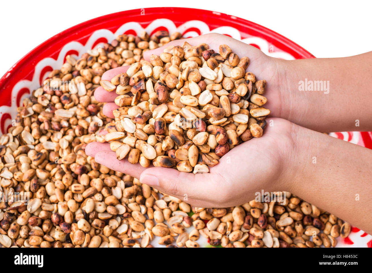Roasted peanuts in woman hand Stock Photo - Alamy
