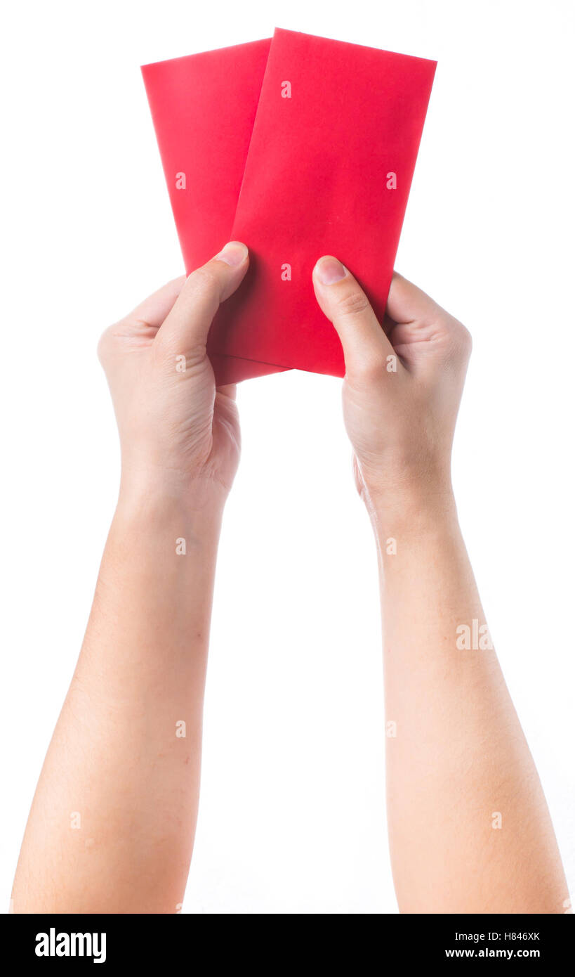 Hand holding chinese red envelope isolated over white background Stock ...
