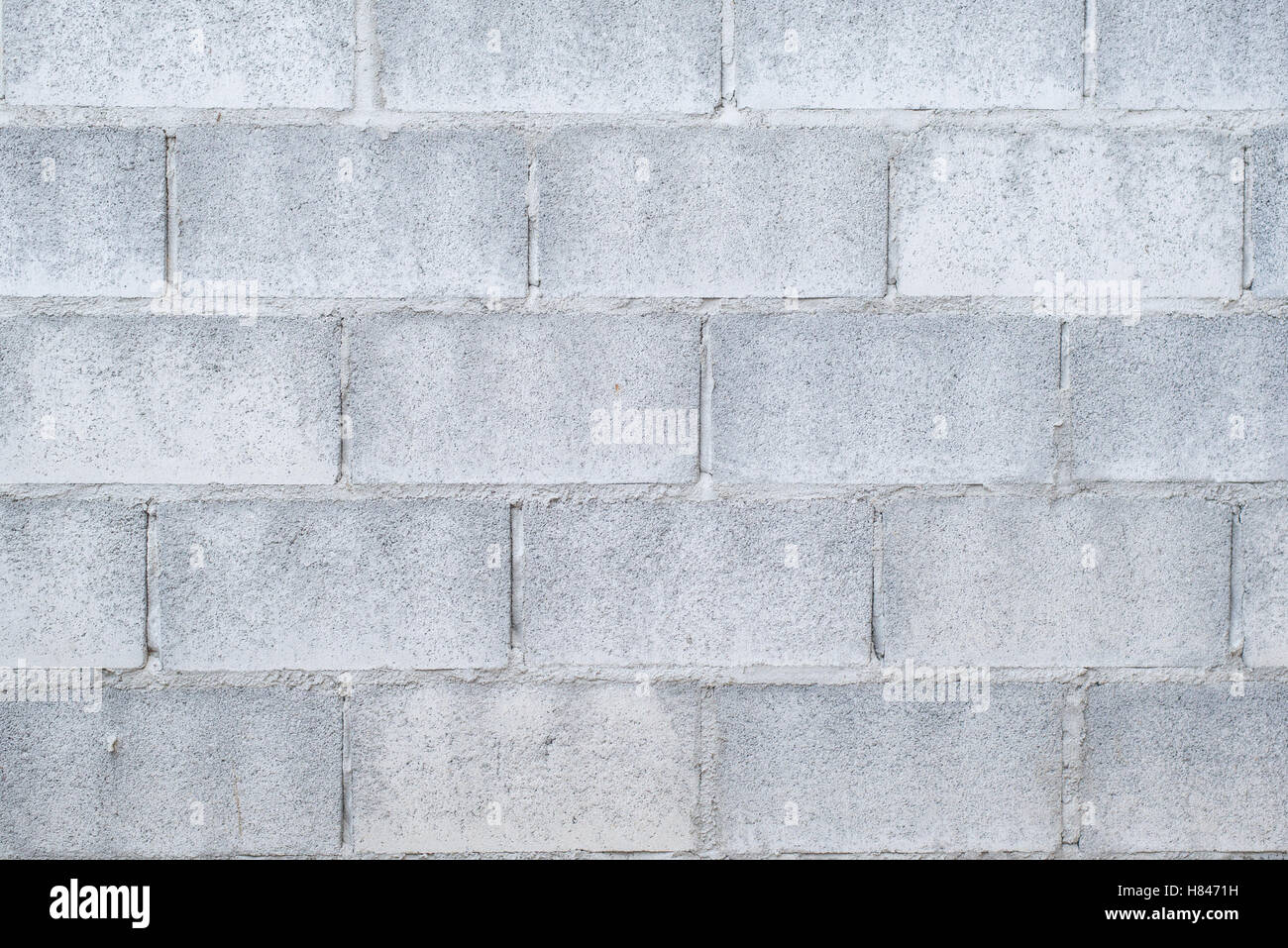 Brick block wall material background Stock Photo - Alamy