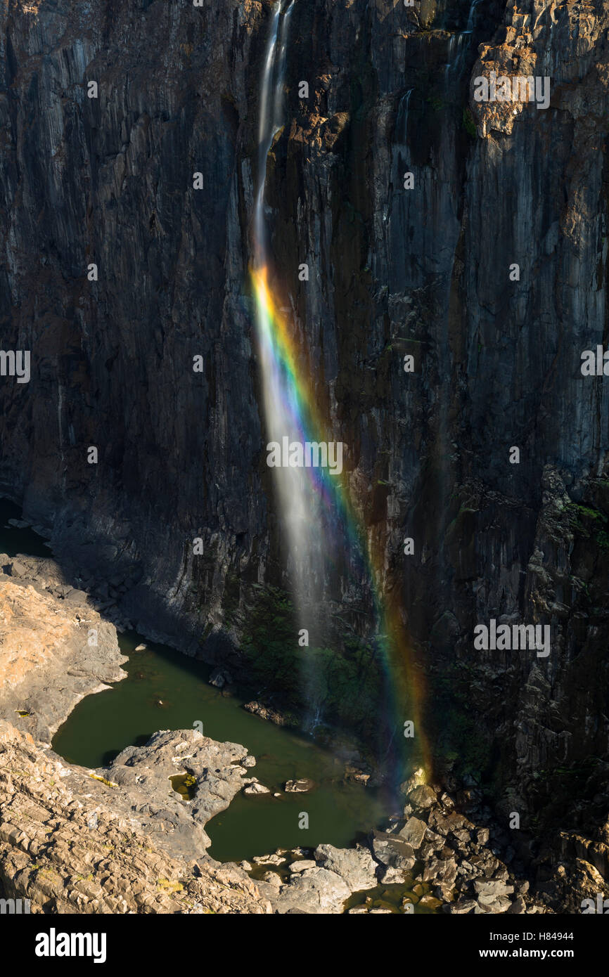Rainbow formed in mist from waterfall, Victoria Falls, Zimbabwe Stock ...