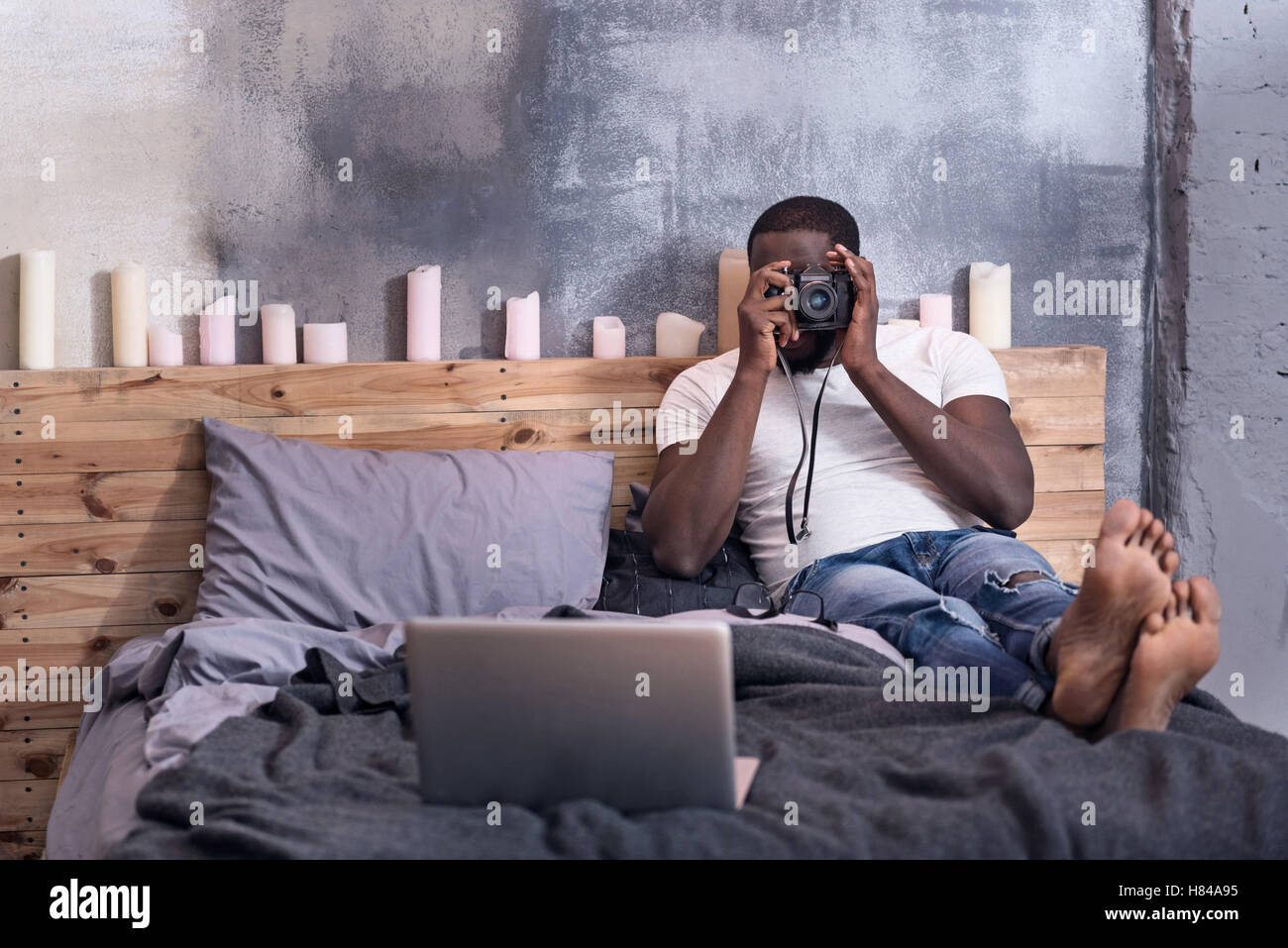 African man photographer holding hi-res stock photography and images ...