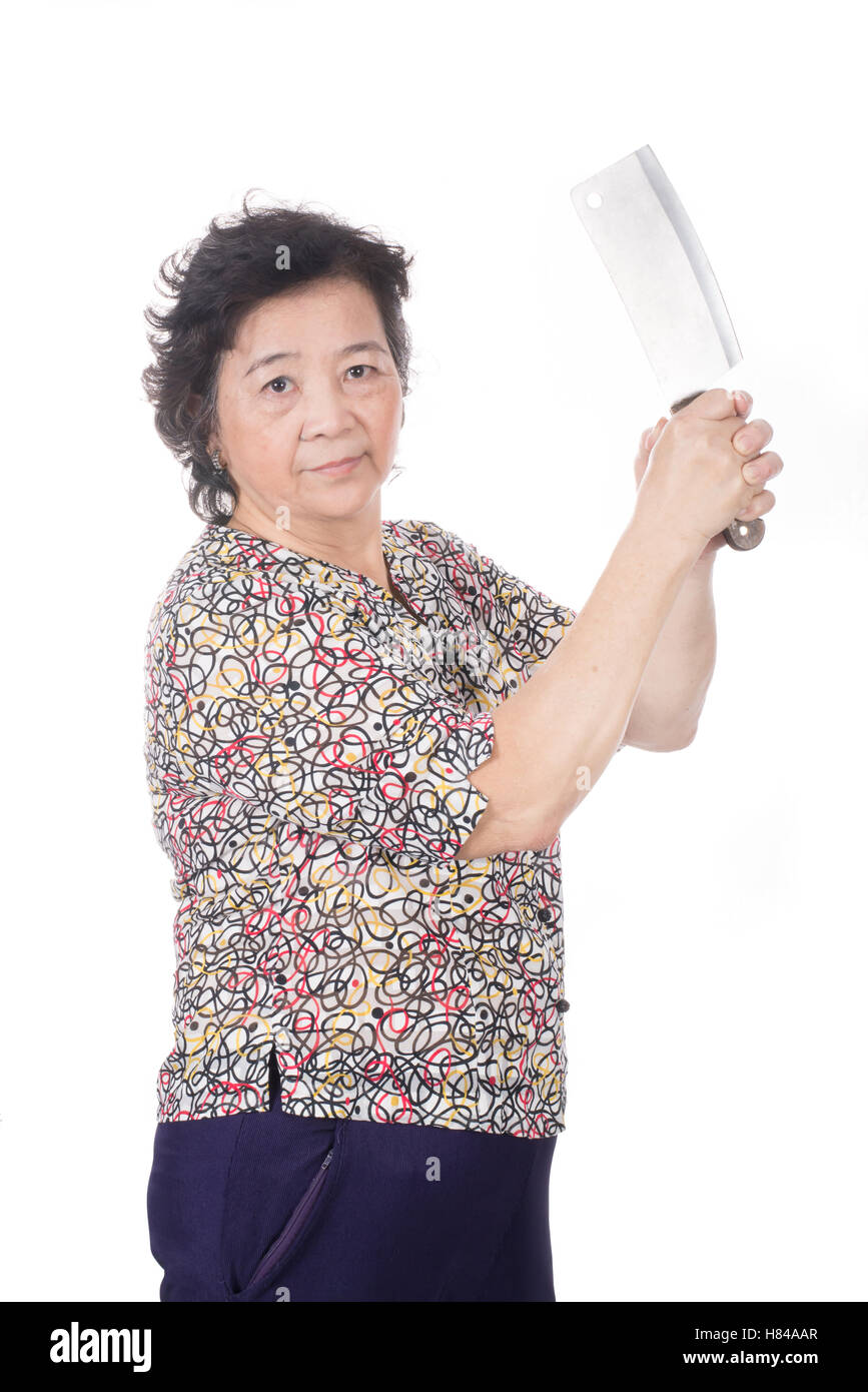Asian old woman holding chopping knife in hand, isolated on white ...