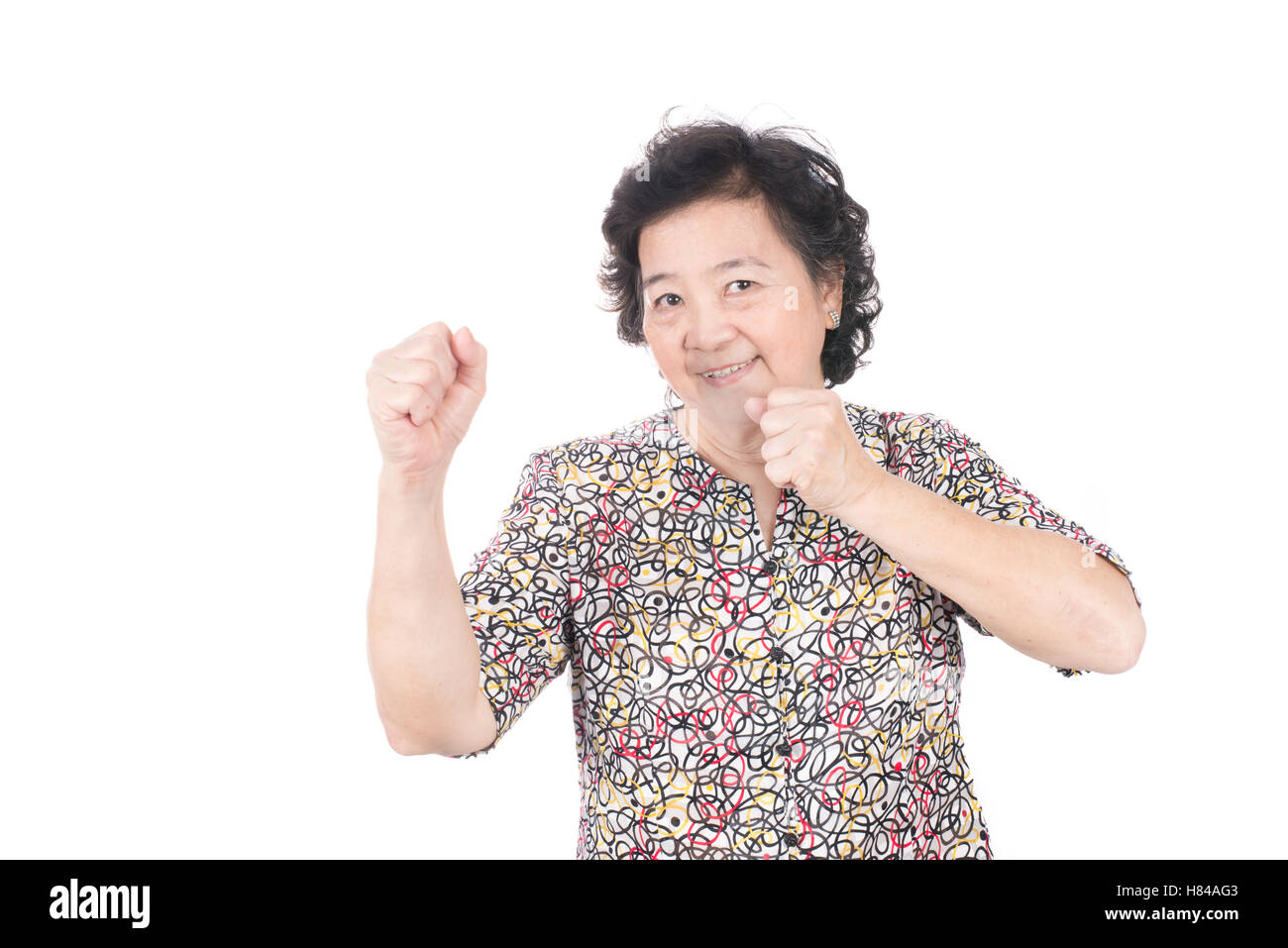 Asian old woman giving punch over isolated white background Stock Photo ...