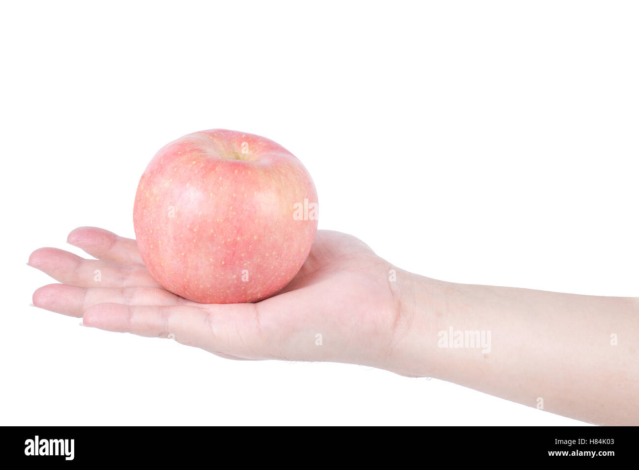 Hand with an apple isolated on white background Stock Photo - Alamy