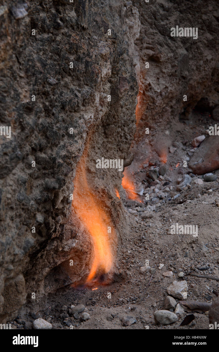 Smokeless fires dance where natural gas seeps from cracks in limestone ...