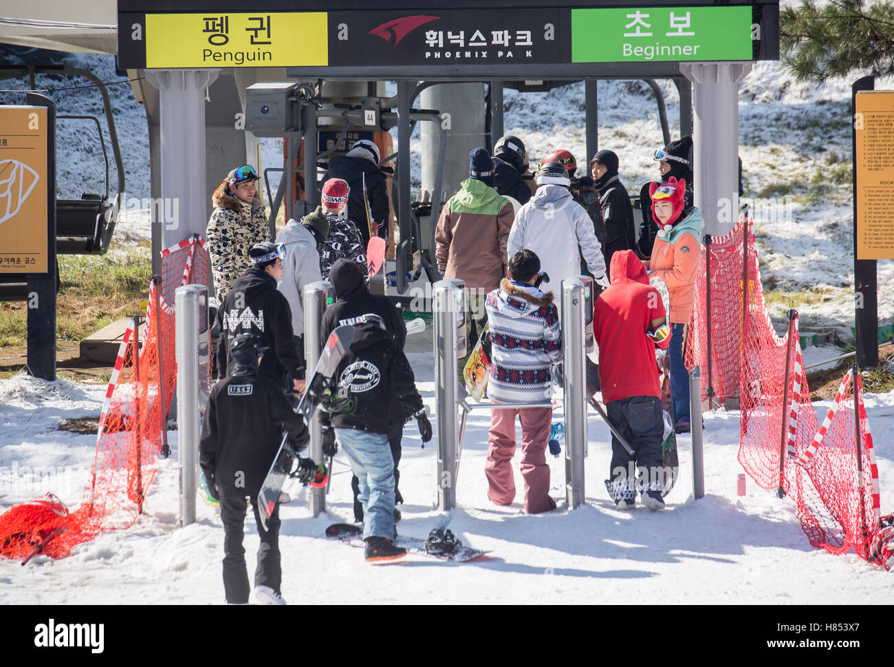 Snowboarders stand in the Bokwang Snow Park, the place where the ...