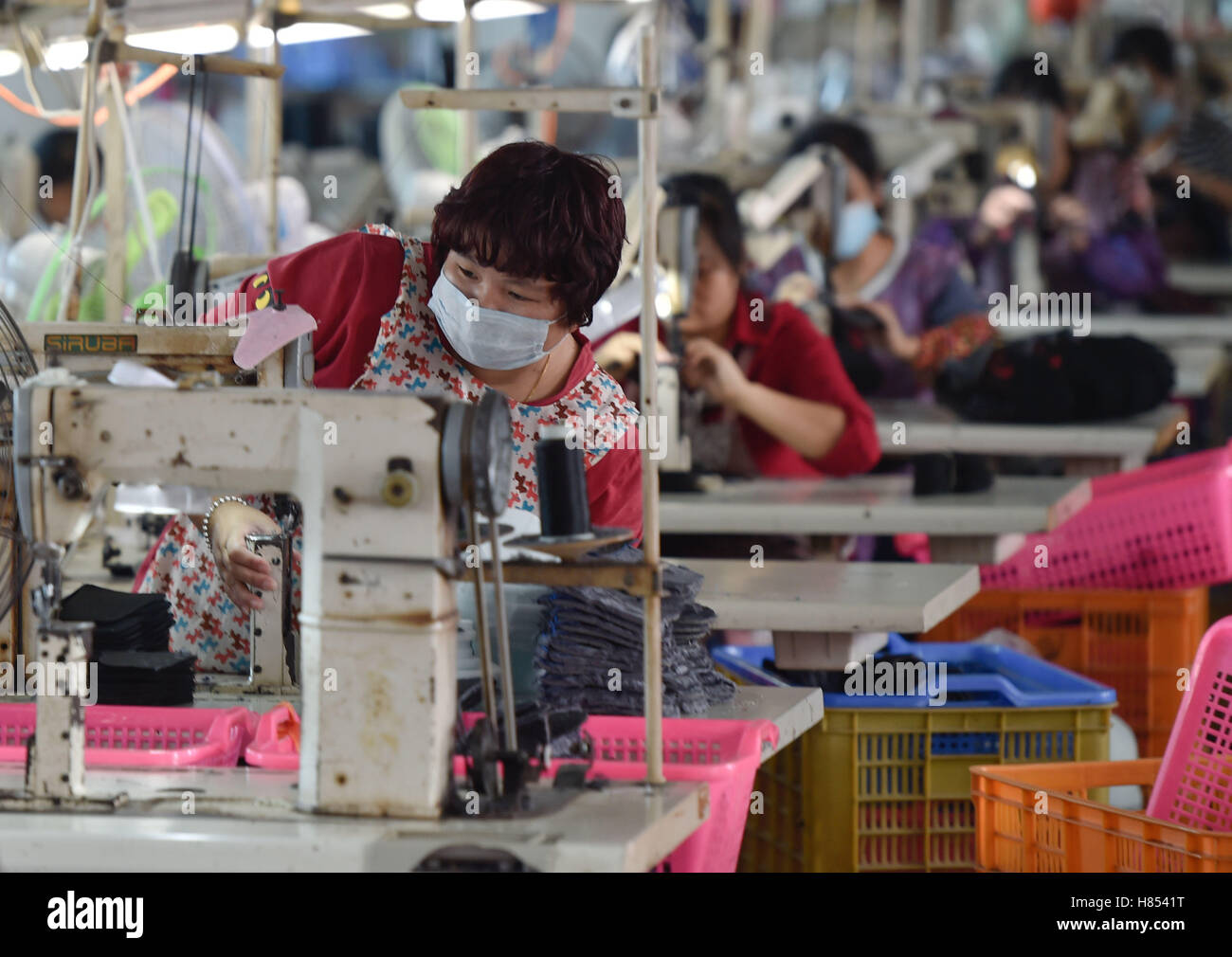 Nan'an, China's Fujian Province. 10th Nov, 2016. Women work at a ...