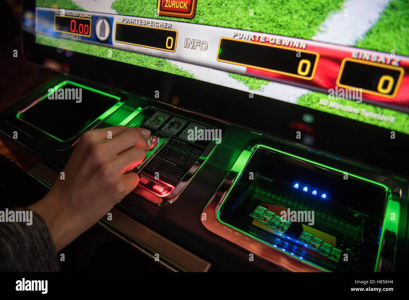 ILLUSTRATION. A woman uses a gambling machine during a demonstration of ...