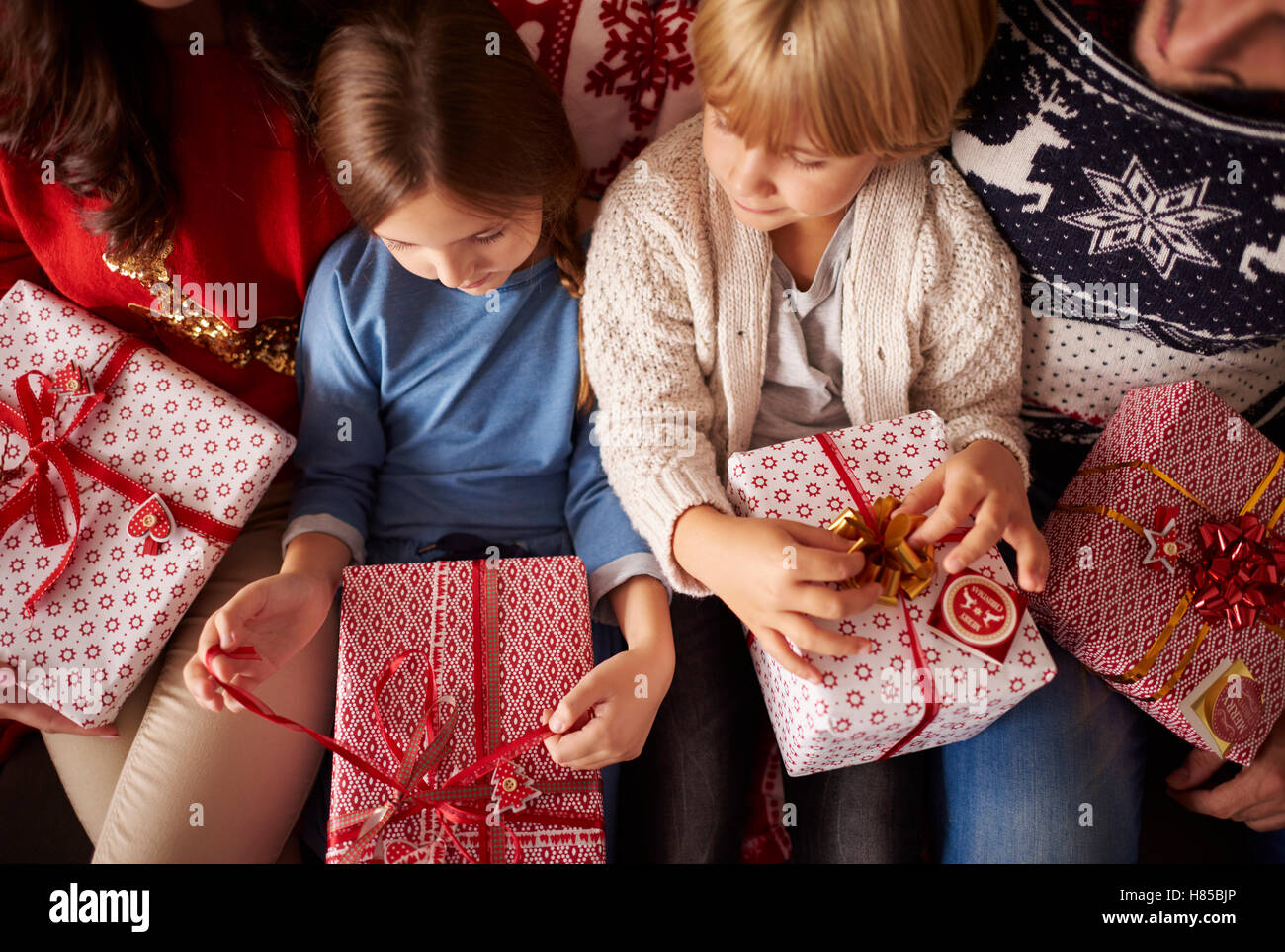 Little kids are ready for opening Christmas presents Stock Photo - Alamy