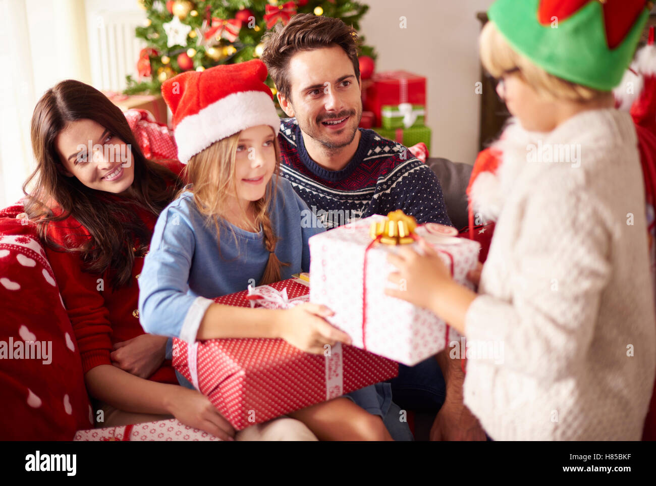 Happy family celebrating Christmas together Stock Photo - Alamy