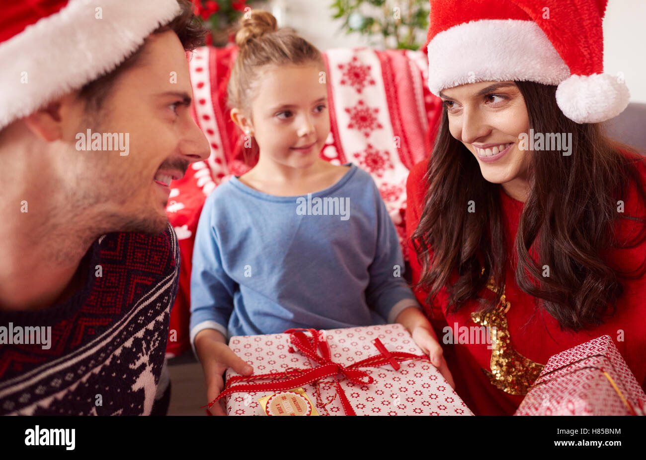 Happy family at Christmas with presents Stock Photo - Alamy