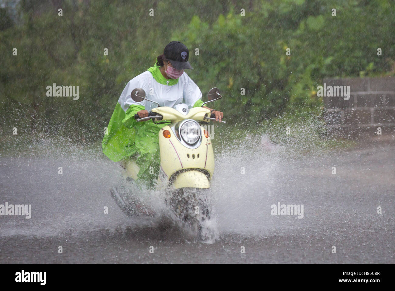 Moped vietnam rain hi-res stock photography and images - Alamy