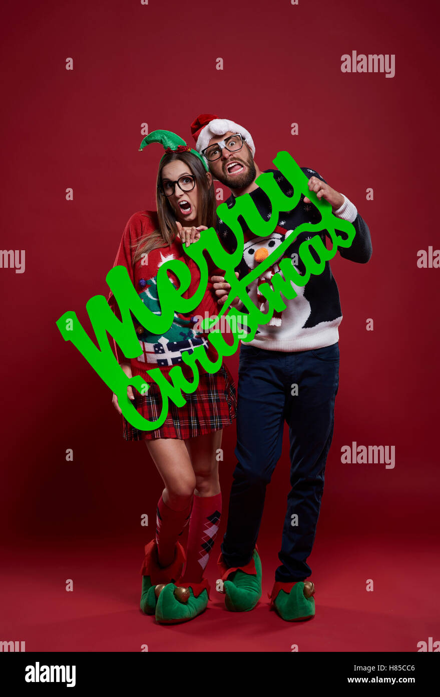 Happy nerd couple in Christmas Stock Photo - Alamy