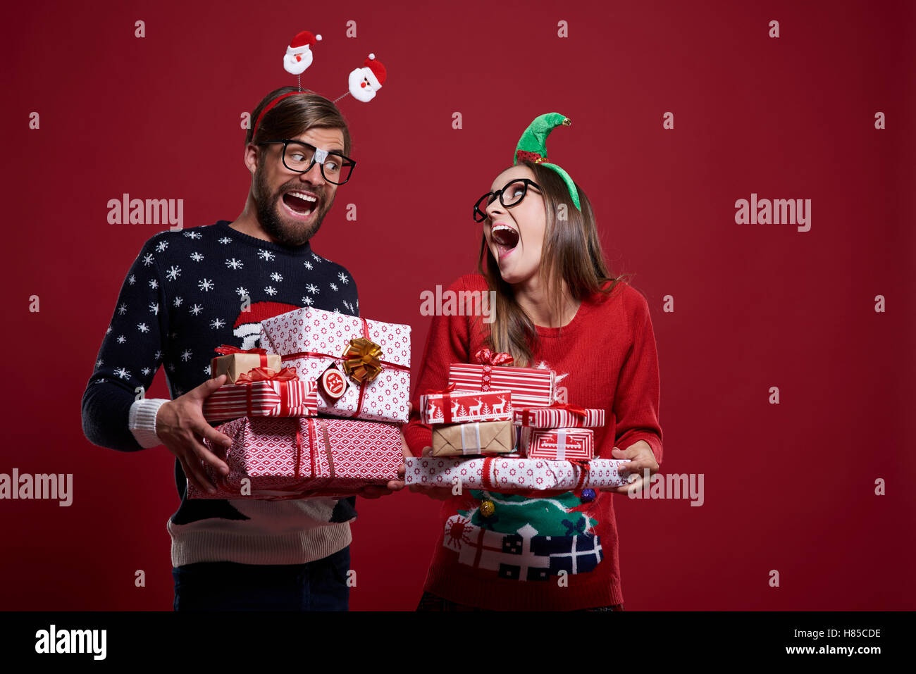 Funny Christmas nerds with presents Stock Photo - Alamy