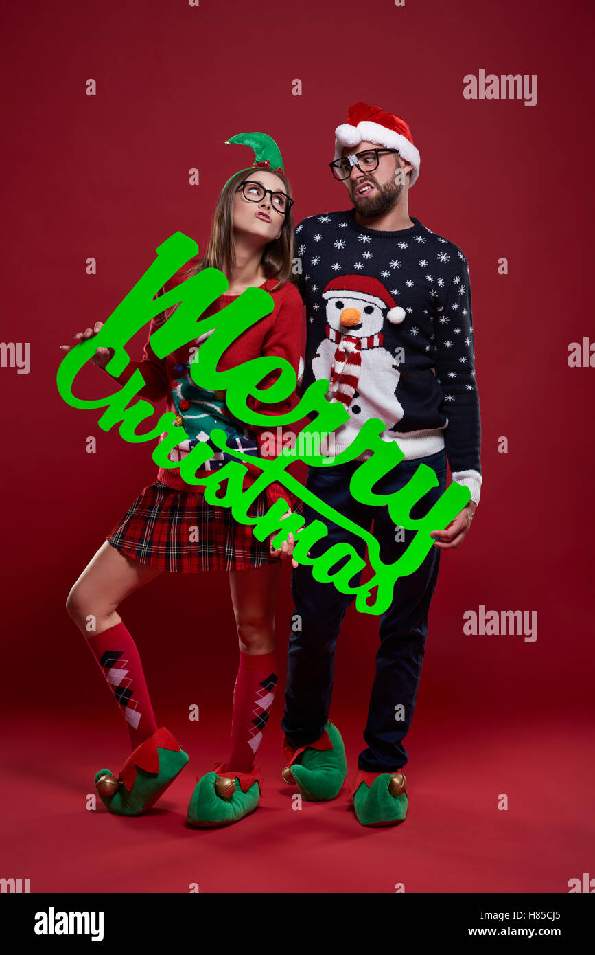 Nerd couple with the best wishes for Christmas Stock Photo - Alamy
