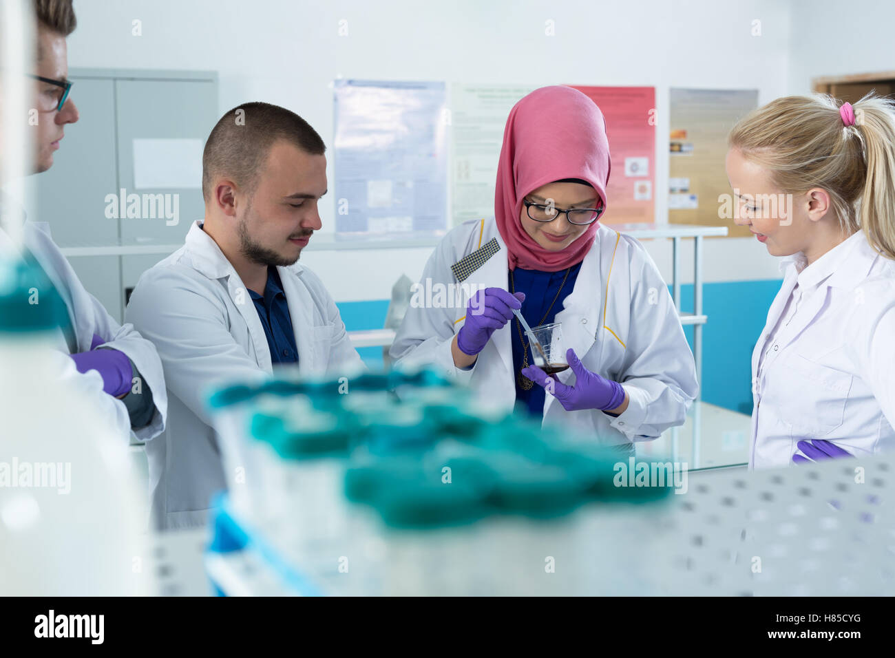group of scientists working at the laboratory Stock Photo - Alamy