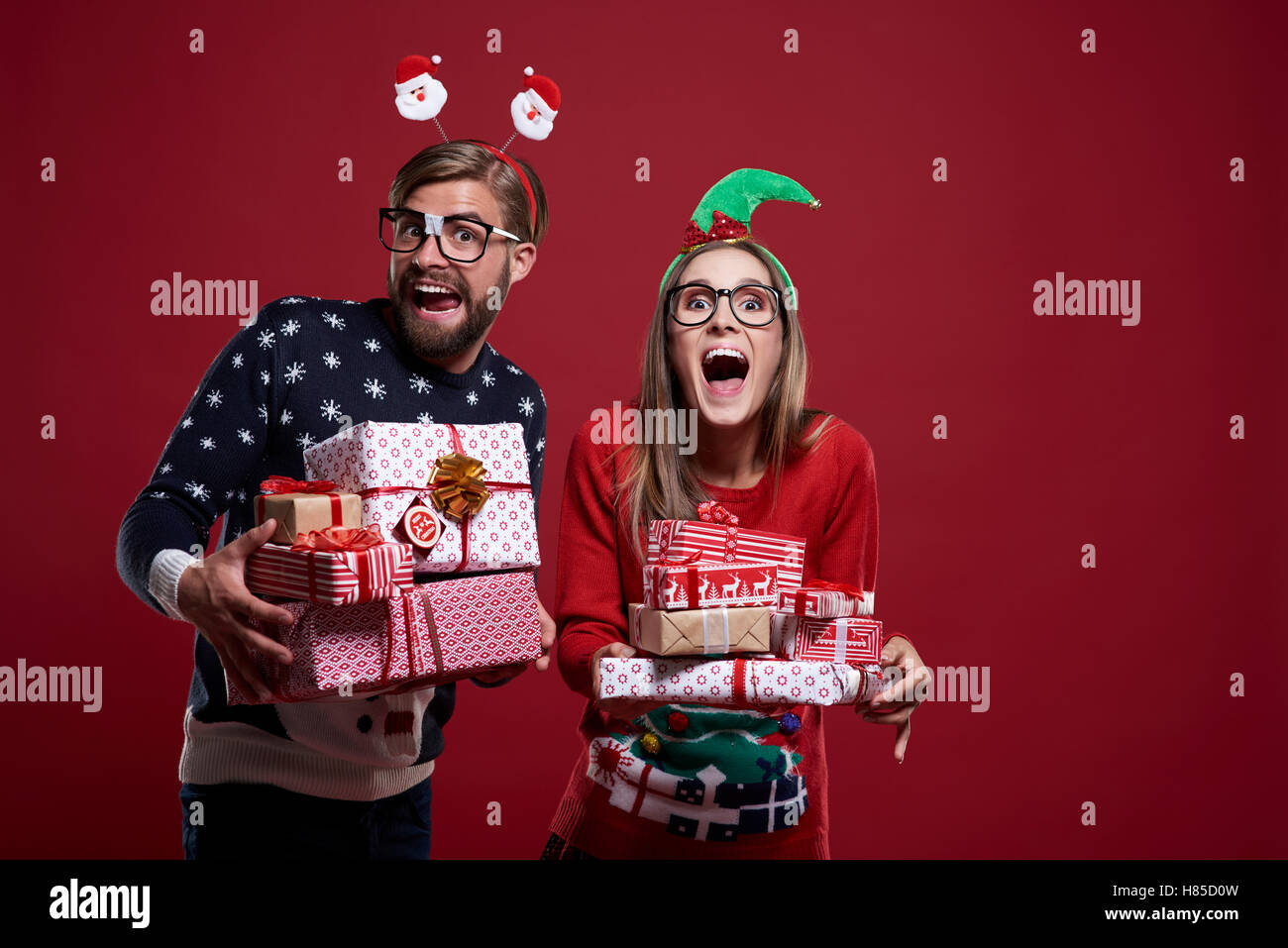 Happy about big pile of presents Stock Photo - Alamy