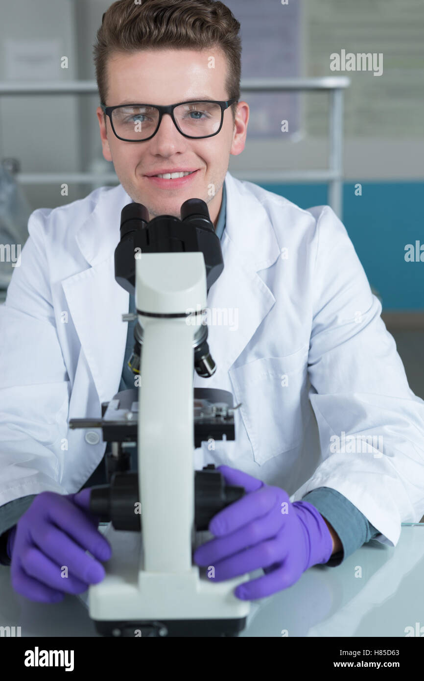 young doctor scientist in bright labaratory work research and analyse ...