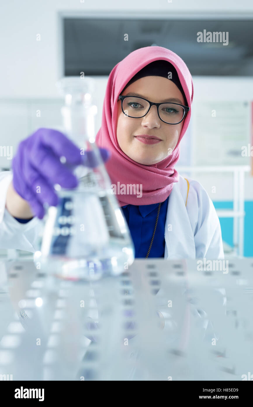 muslim lab worker with hijab or researcher doing an analysis in ...