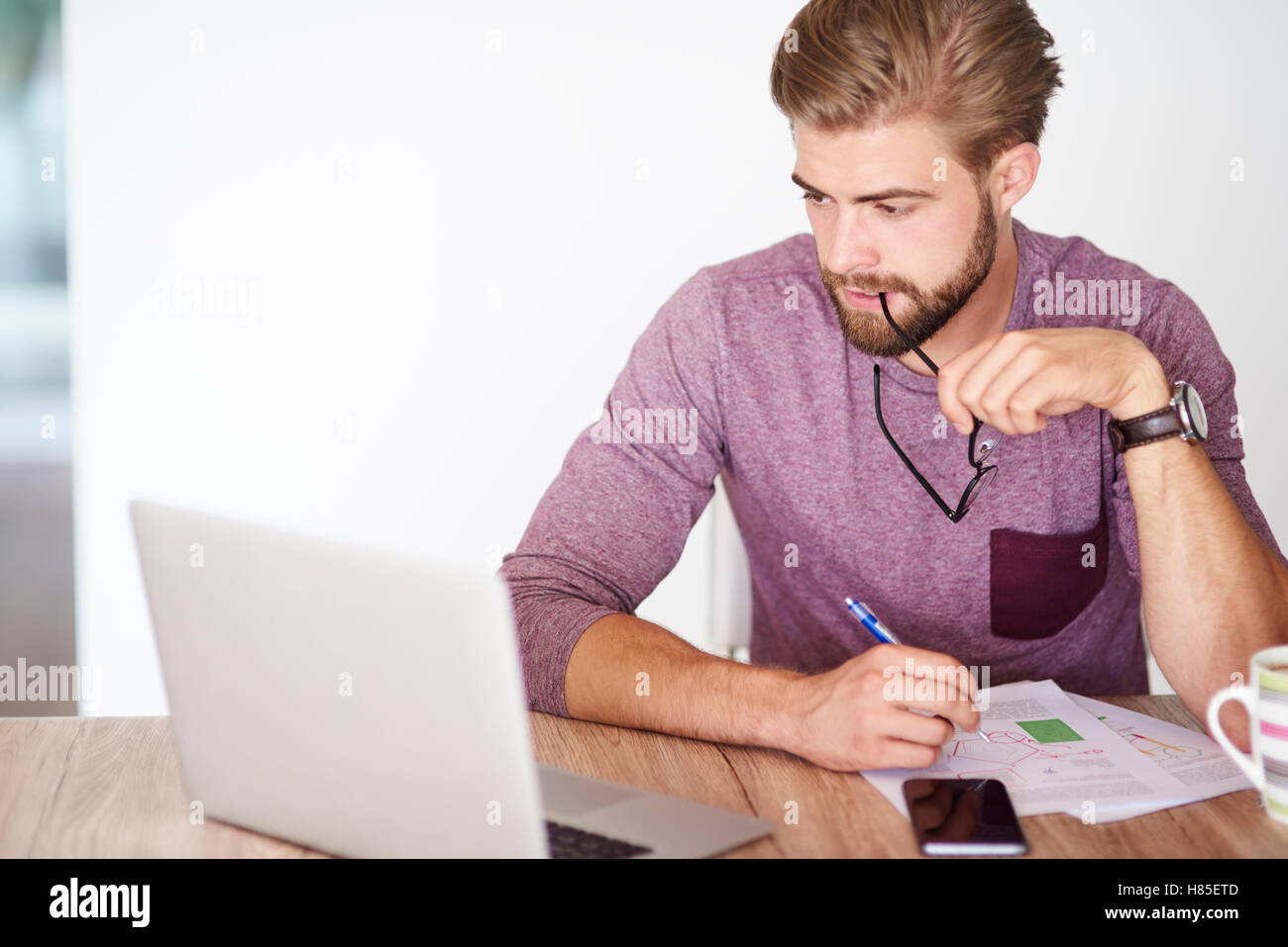 Analyzing man working home hi-res stock photography and images - Alamy
