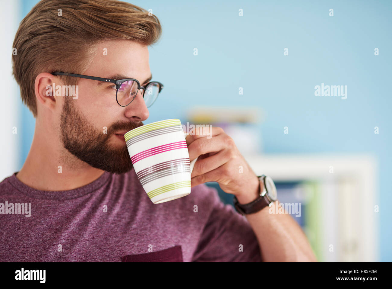 Sip of coffee in the house Stock Photo - Alamy