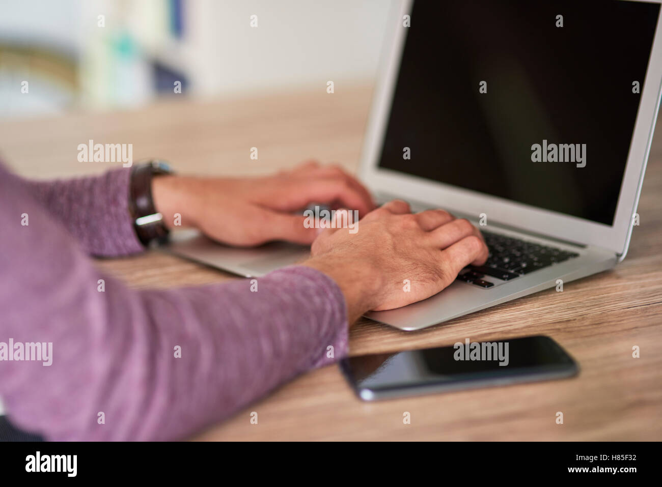 Man writing on computer keyboard Stock Photo - Alamy