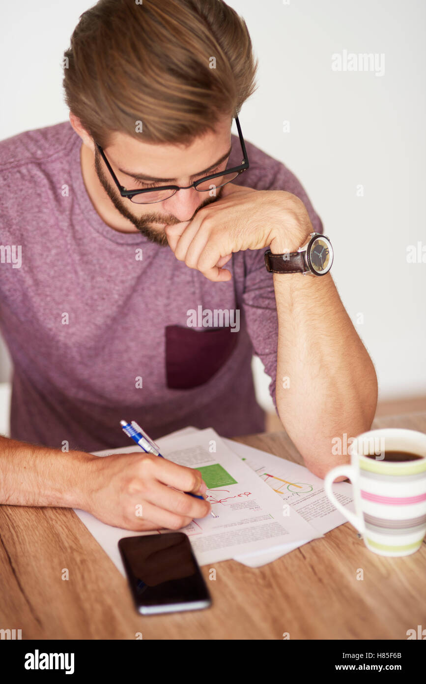 High angle view on man working over documents Stock Photo - Alamy