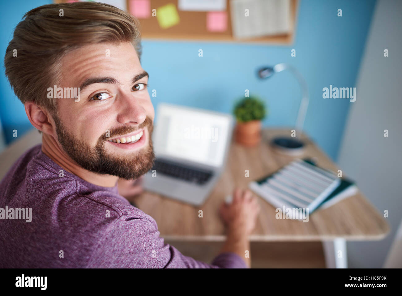 Man on computer home rear view hi-res stock photography and images - Alamy