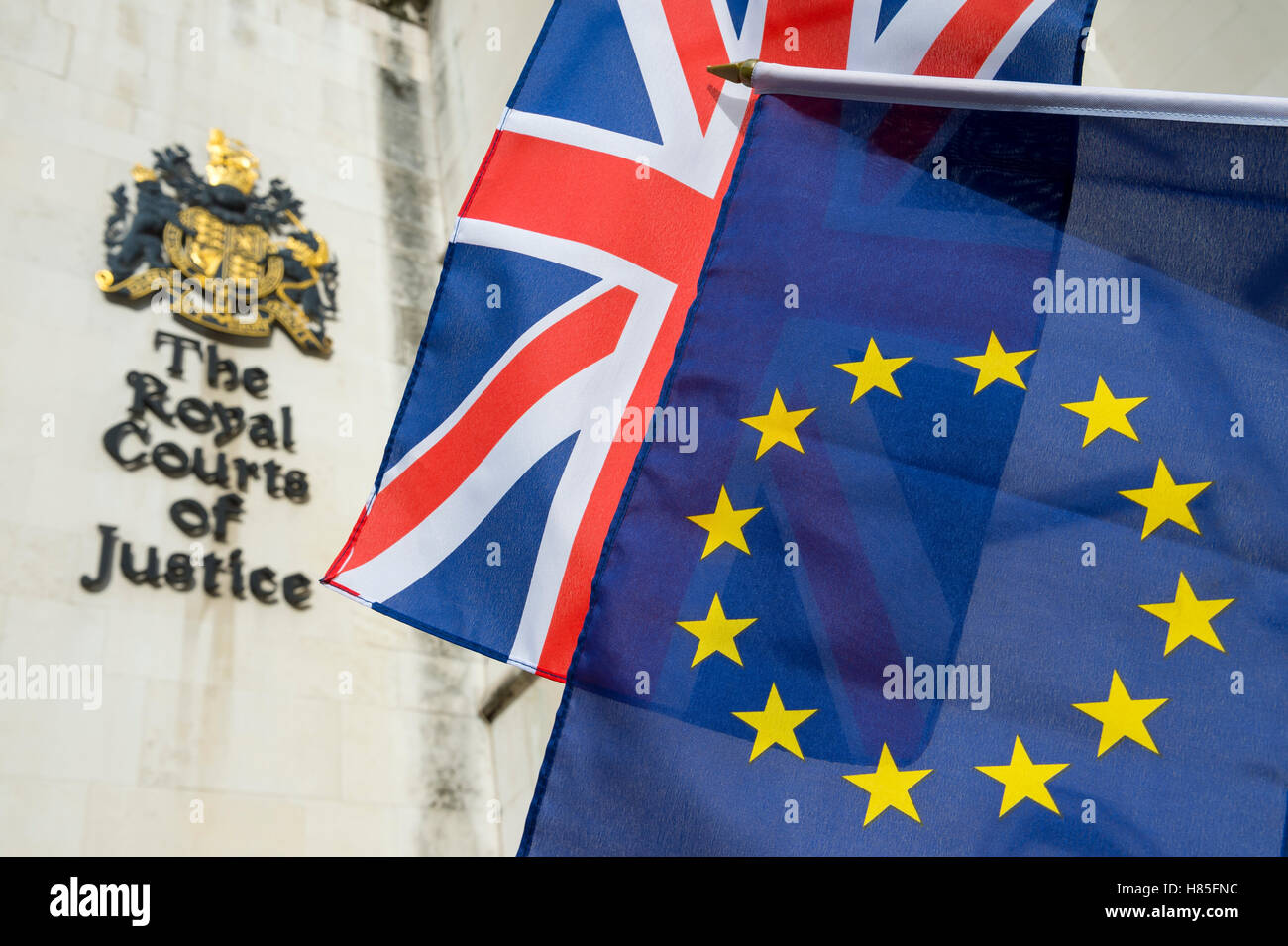 EU and Union Jack flags flying in front of The Royal Courts of Justice ...
