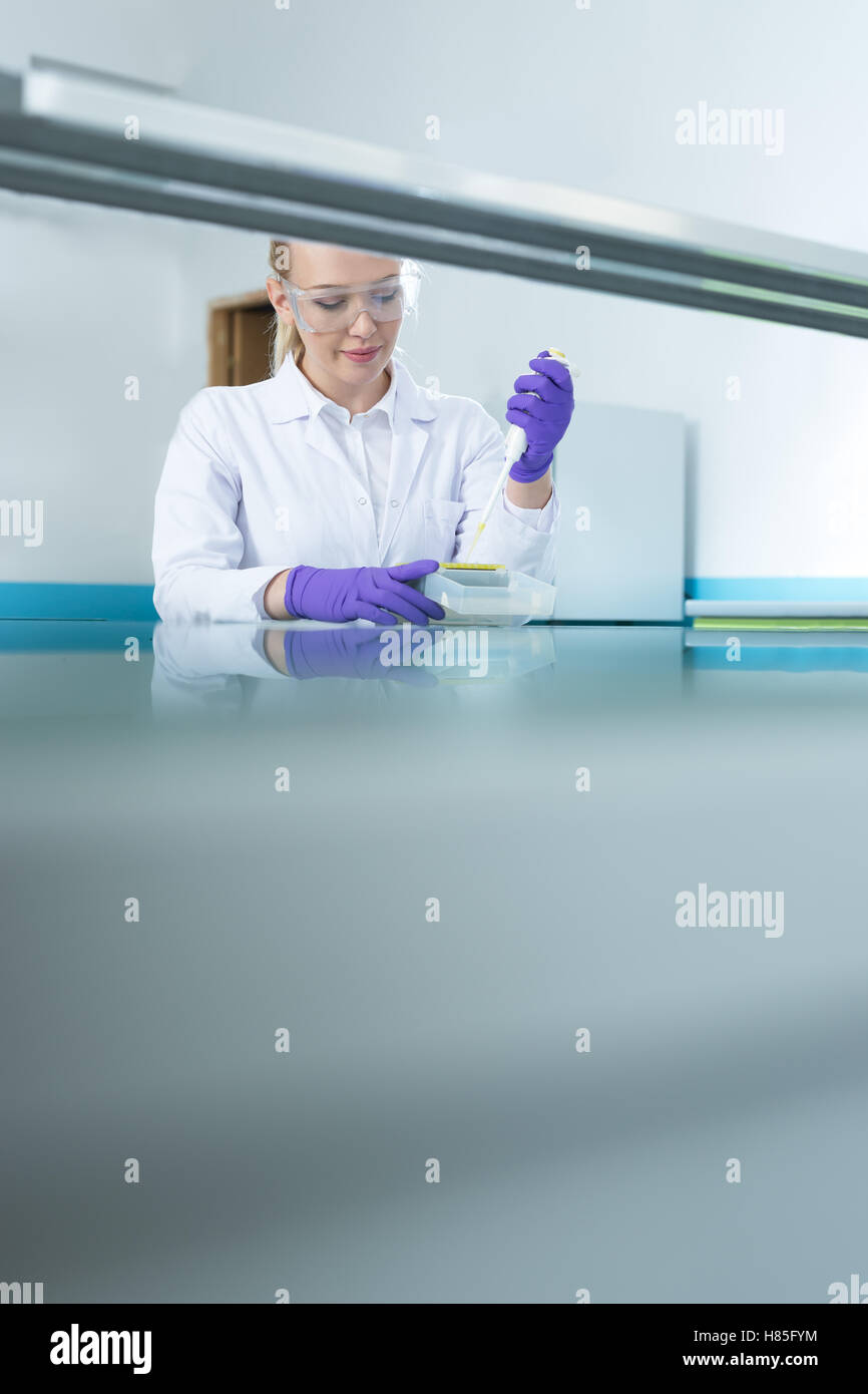 Young pretty girl in the modern laboratory Stock Photo - Alamy