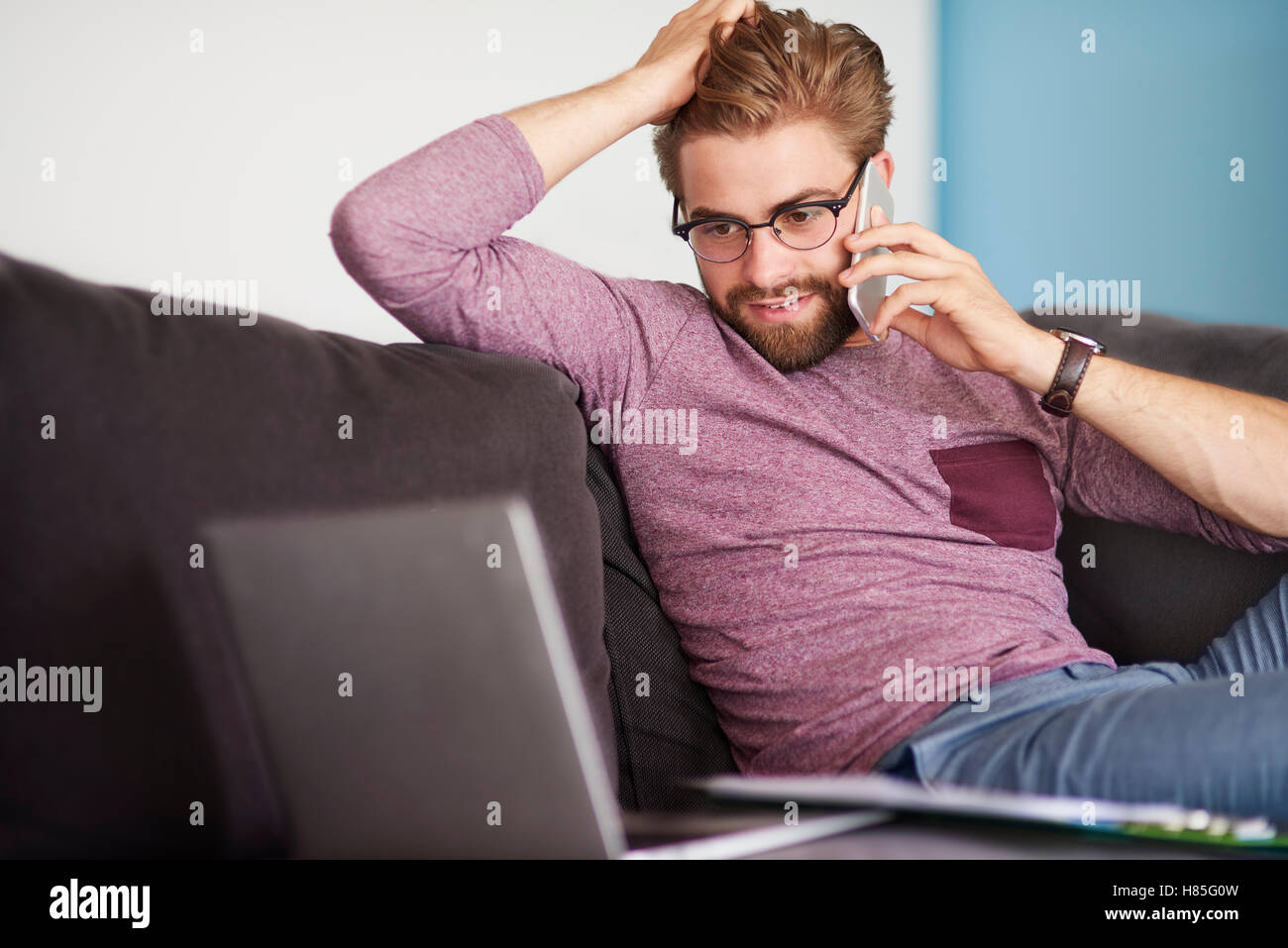 Young man working hard at home Stock Photo - Alamy