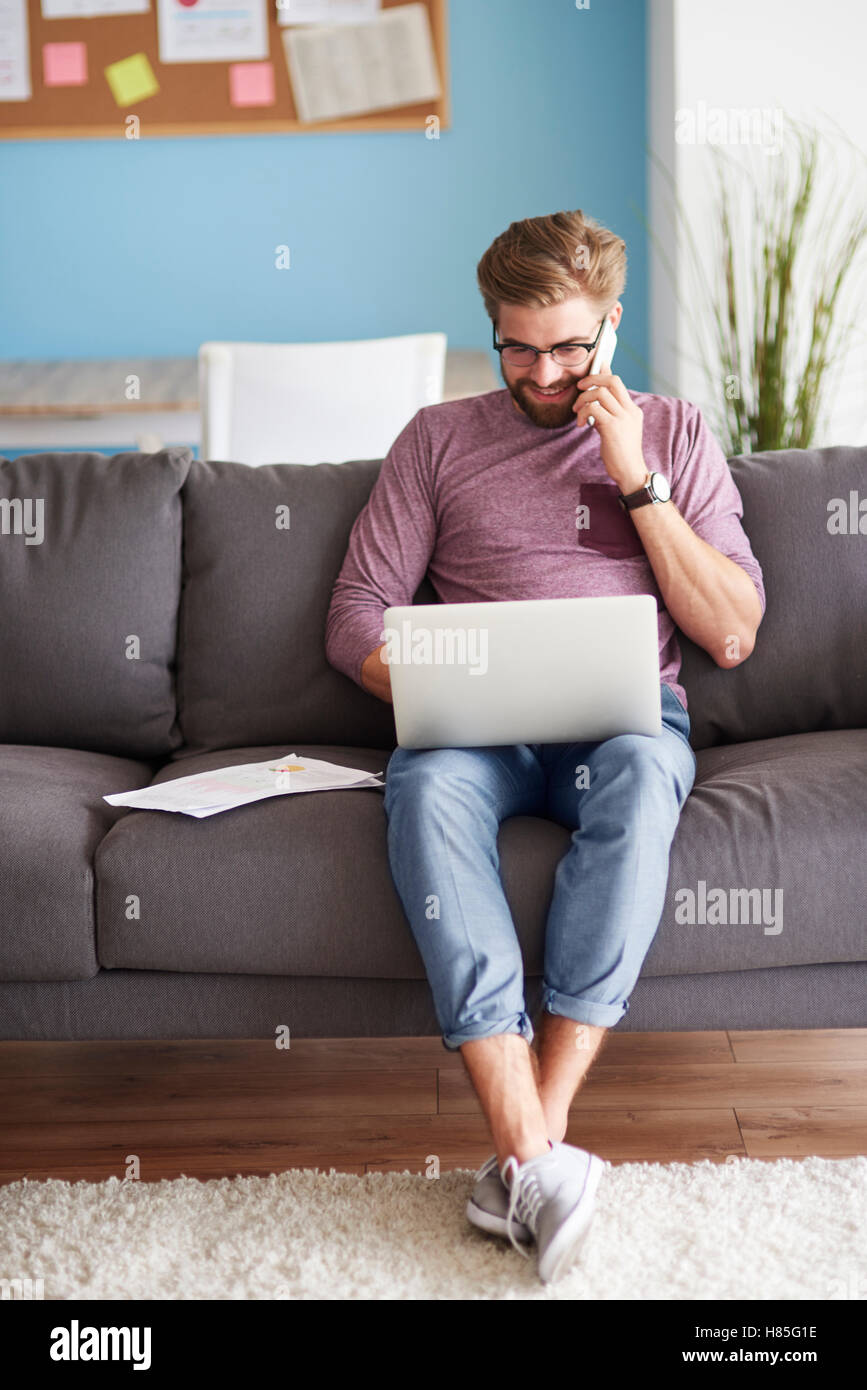 Happy man working at home Stock Photo - Alamy
