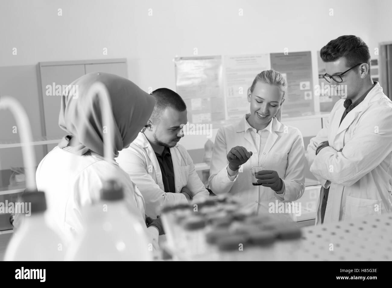Group of scientists working at the laboratory Stock Photo - Alamy