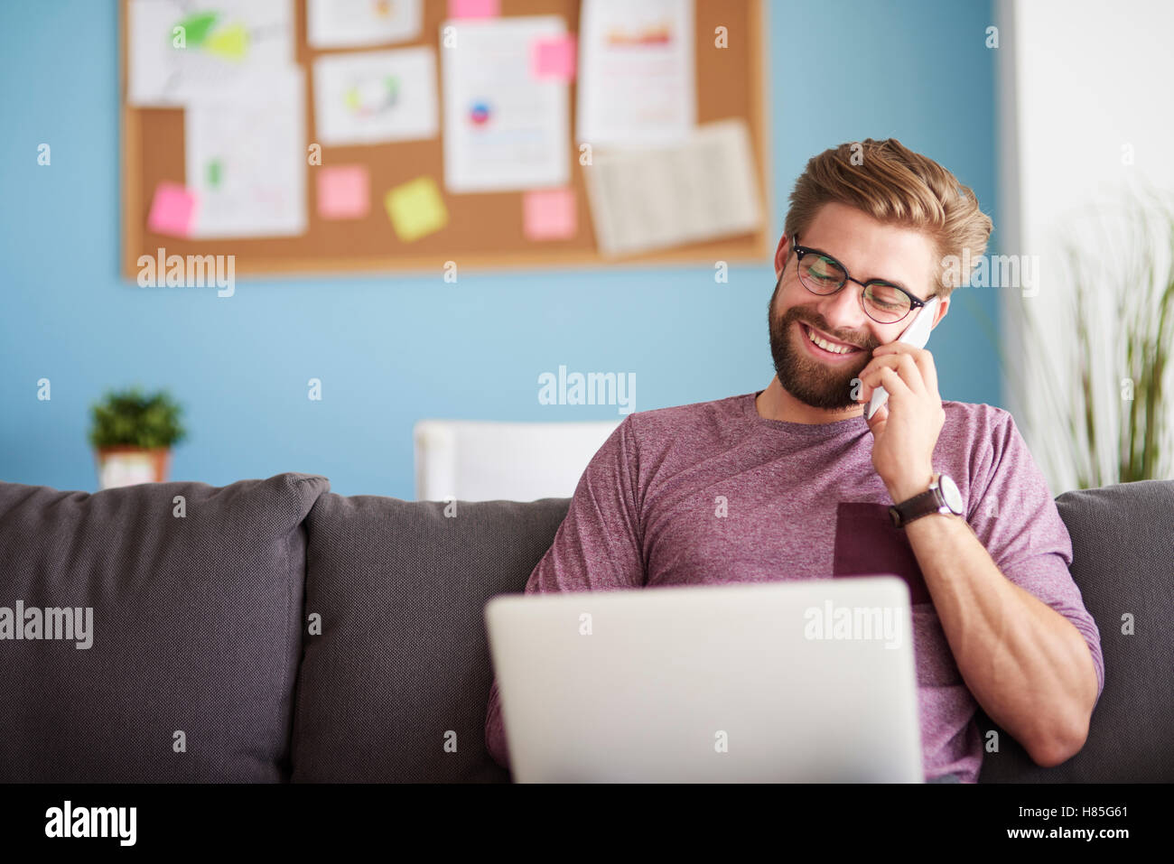 Happy man working at home Stock Photo - Alamy