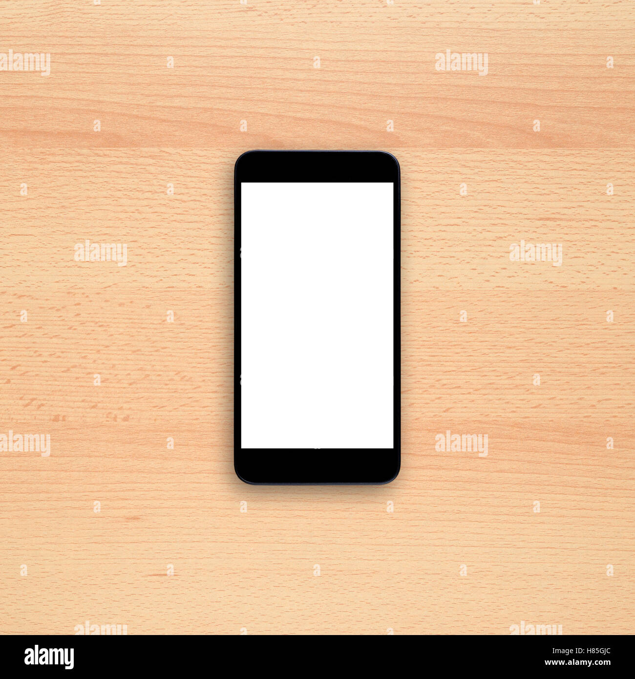 Smartphone on office desk. Vertical view Stock Photo - Alamy