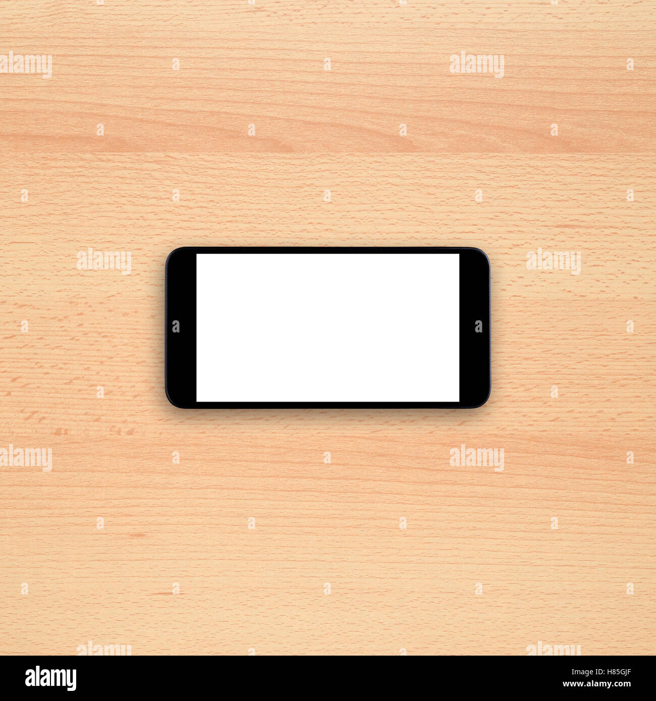 Smartphone on office desk. Horizontal view Stock Photo - Alamy