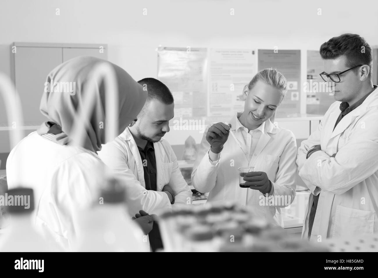 Group of scientists working at the laboratory Stock Photo - Alamy