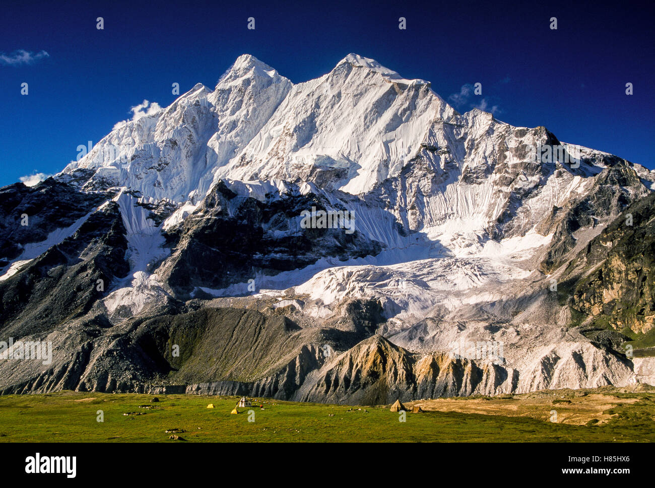 Tibetan tent and campsite on moraine, Chomolonzo Peak, Pethang Ringmo ...