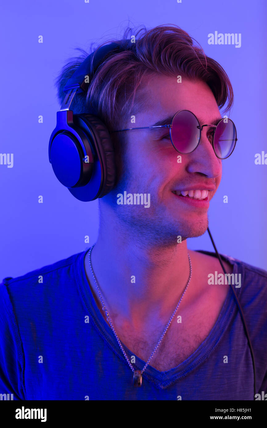 dj with headphones in nightclub party scene, toned image Stock Photo ...