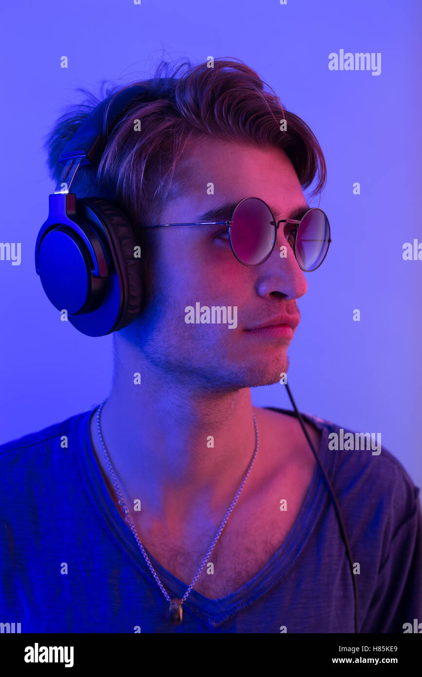 dj with headphones in nightclub party scene, toned image Stock Photo ...