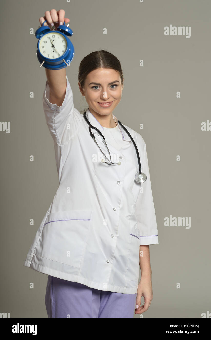 doctor with clock Stock Photo - Alamy