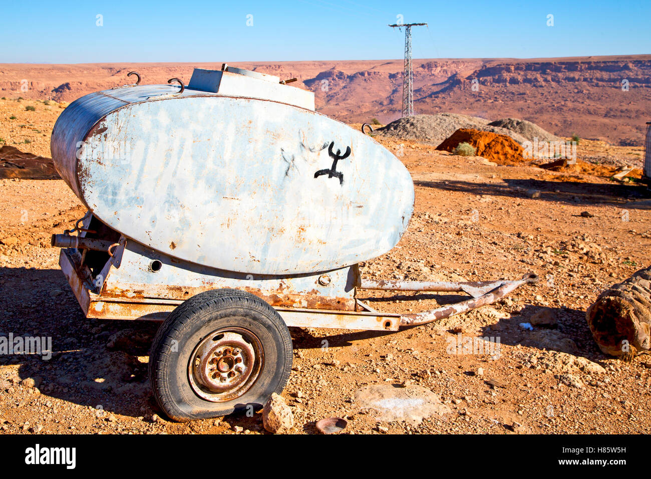 water tank in morocco africa land gray metal weel and arid Stock Photo ...