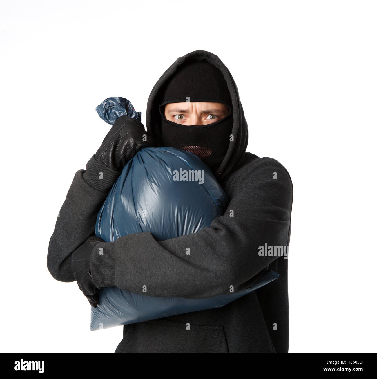 Terrible robber holding large bag Stock Photo - Alamy