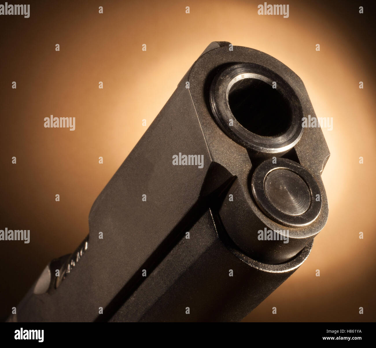 Business end of a semi auto handgun barrel Stock Photo - Alamy
