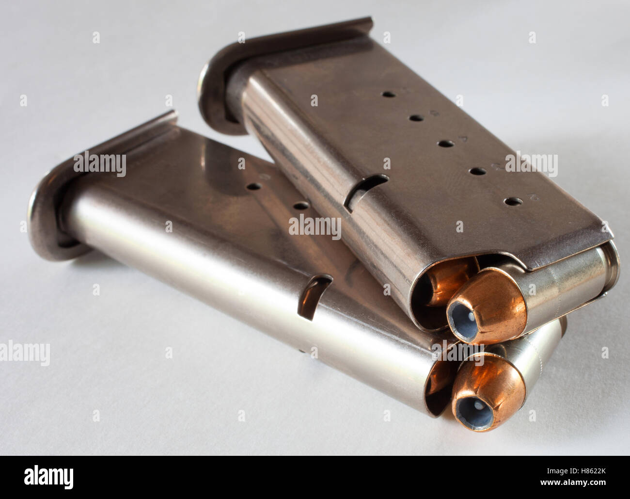Two loaded magazines designed for a hangun Stock Photo - Alamy