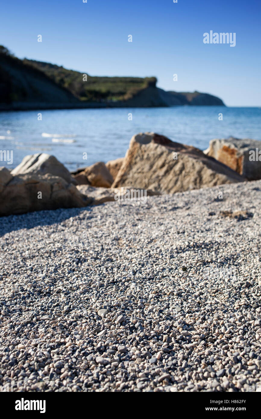 Beach sand round stones hi-res stock photography and images - Alamy
