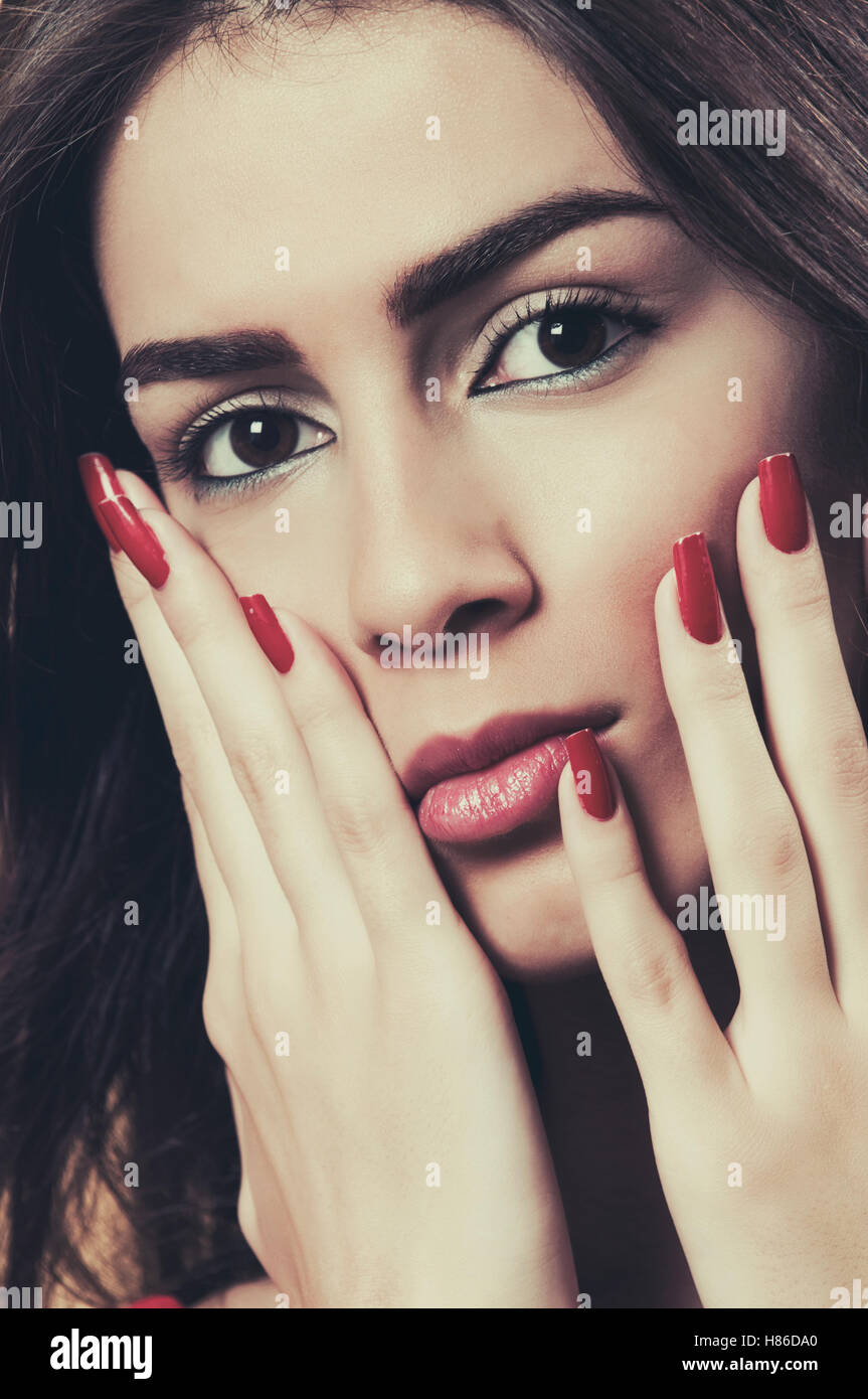 Beautiful young woman hands touching face Stock Photo - Alamy