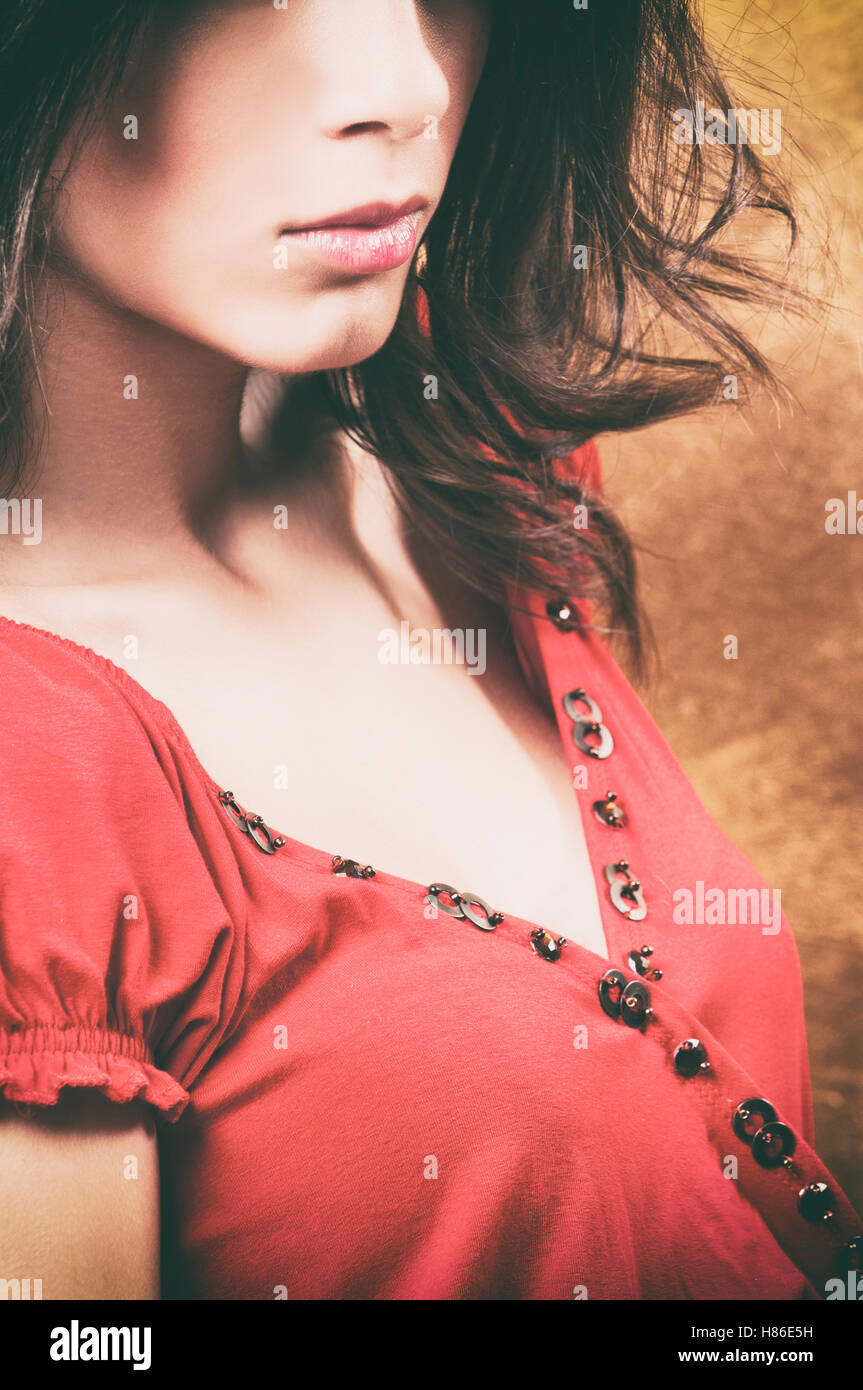 Close up of a young woman wearing a red dress Stock Photo - Alamy