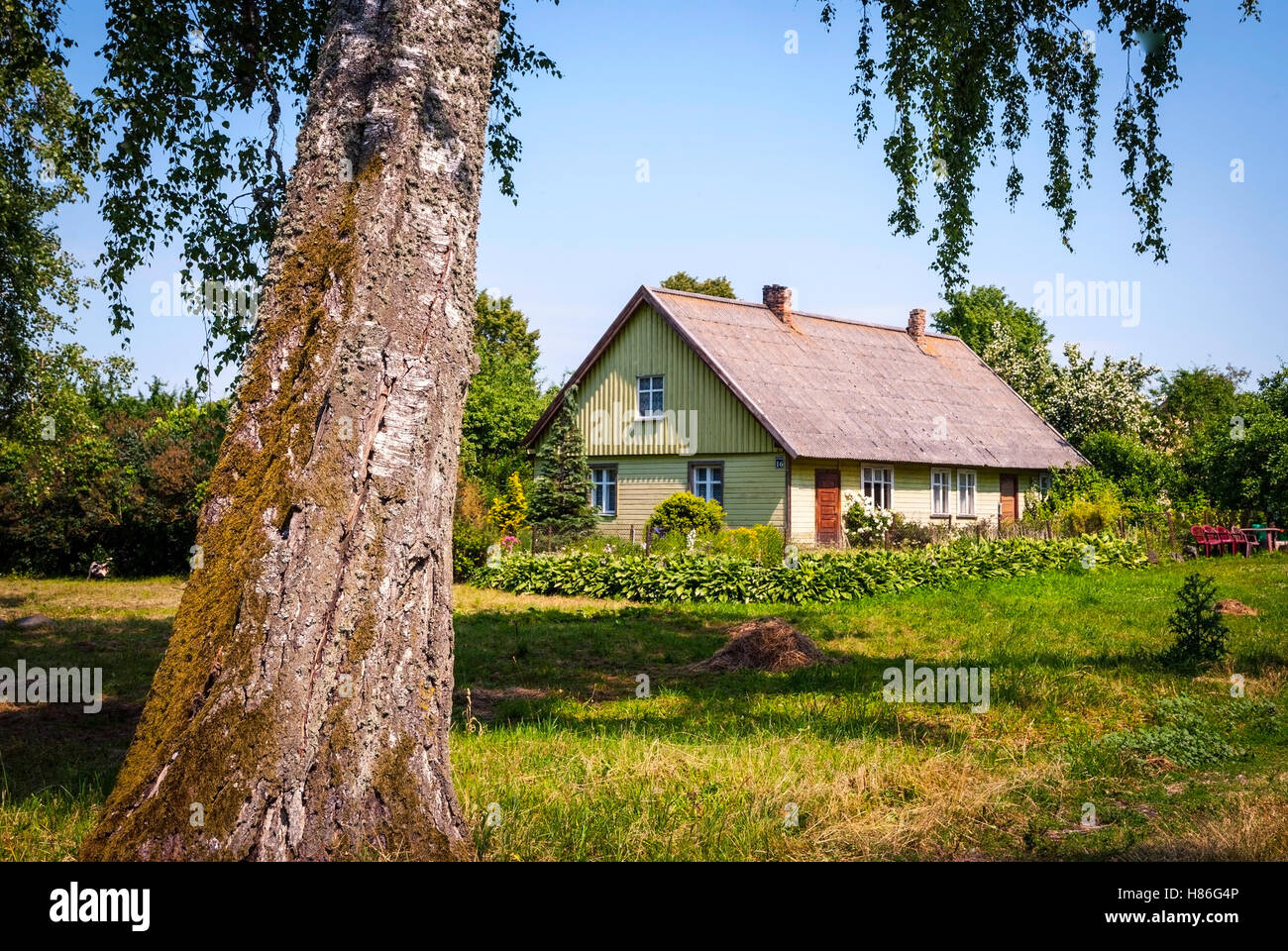Typical lithuanian house in the countryside Stock Photo - Alamy